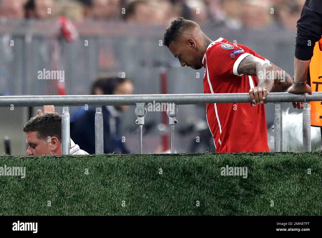 Bayern's Jerome Boateng leaves the pitch after suffering an injury ...