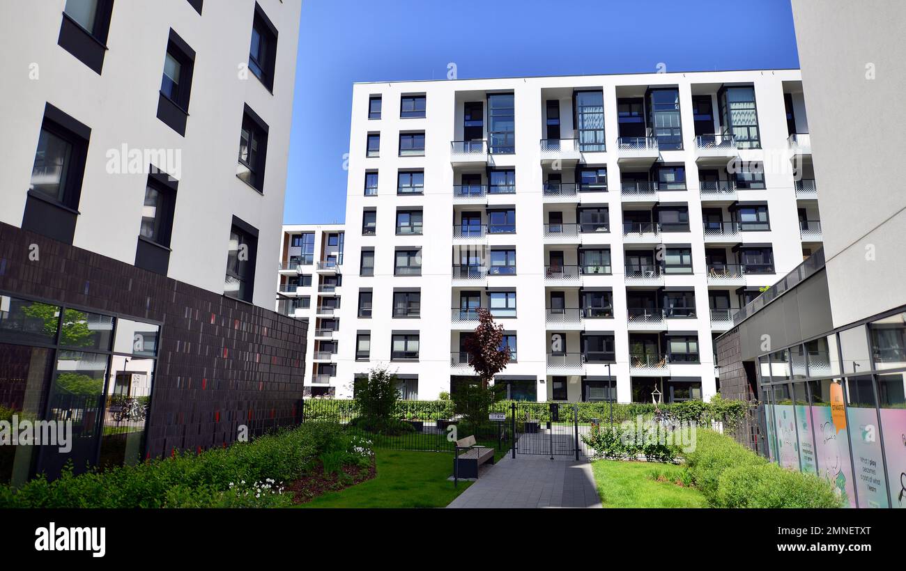 Futuristic square architecture of apartment building. Real estate with ...