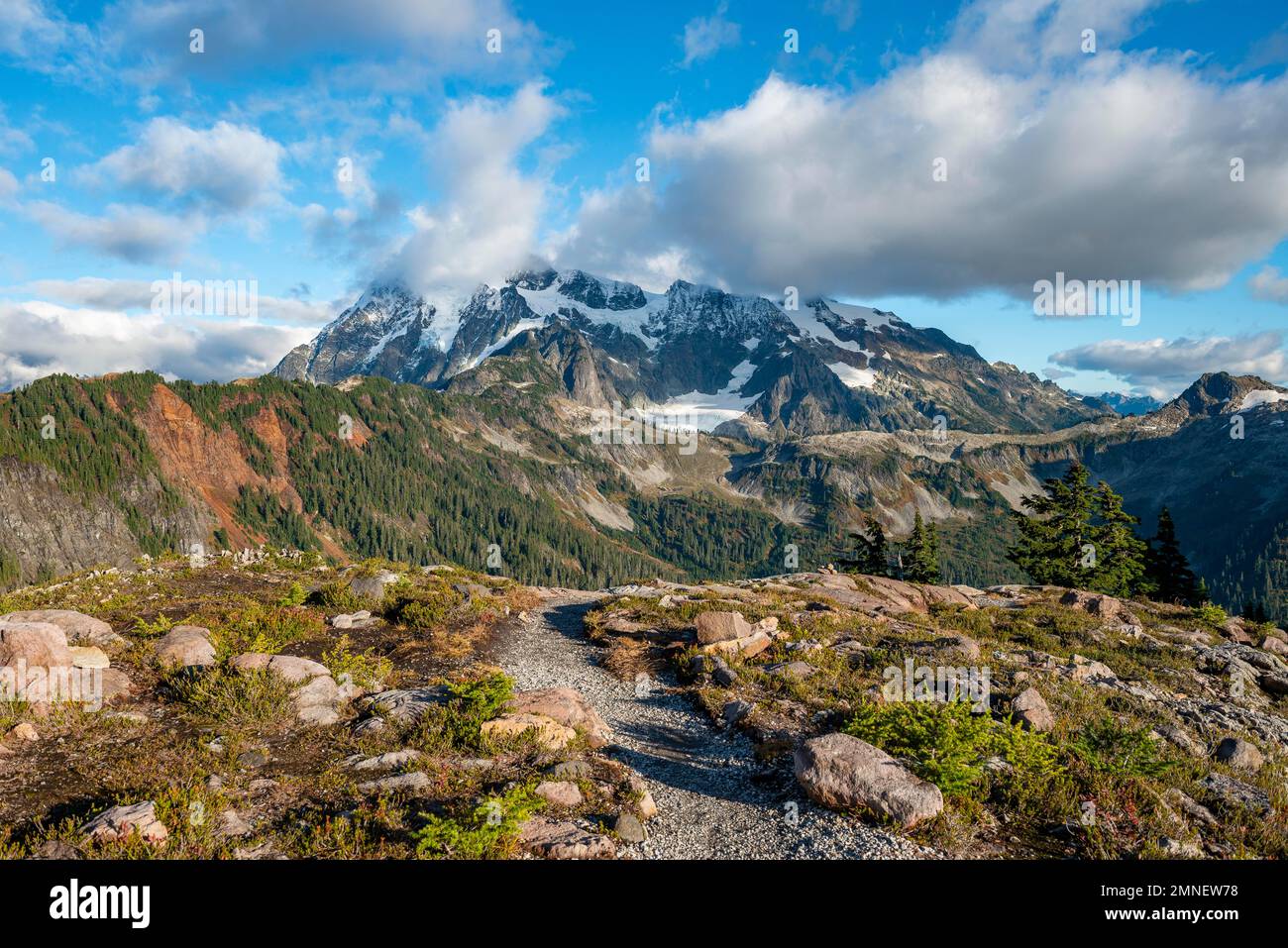 Hiking trail at Huntoon Point, view of cloudy Mt. Shuksan with glacier ...