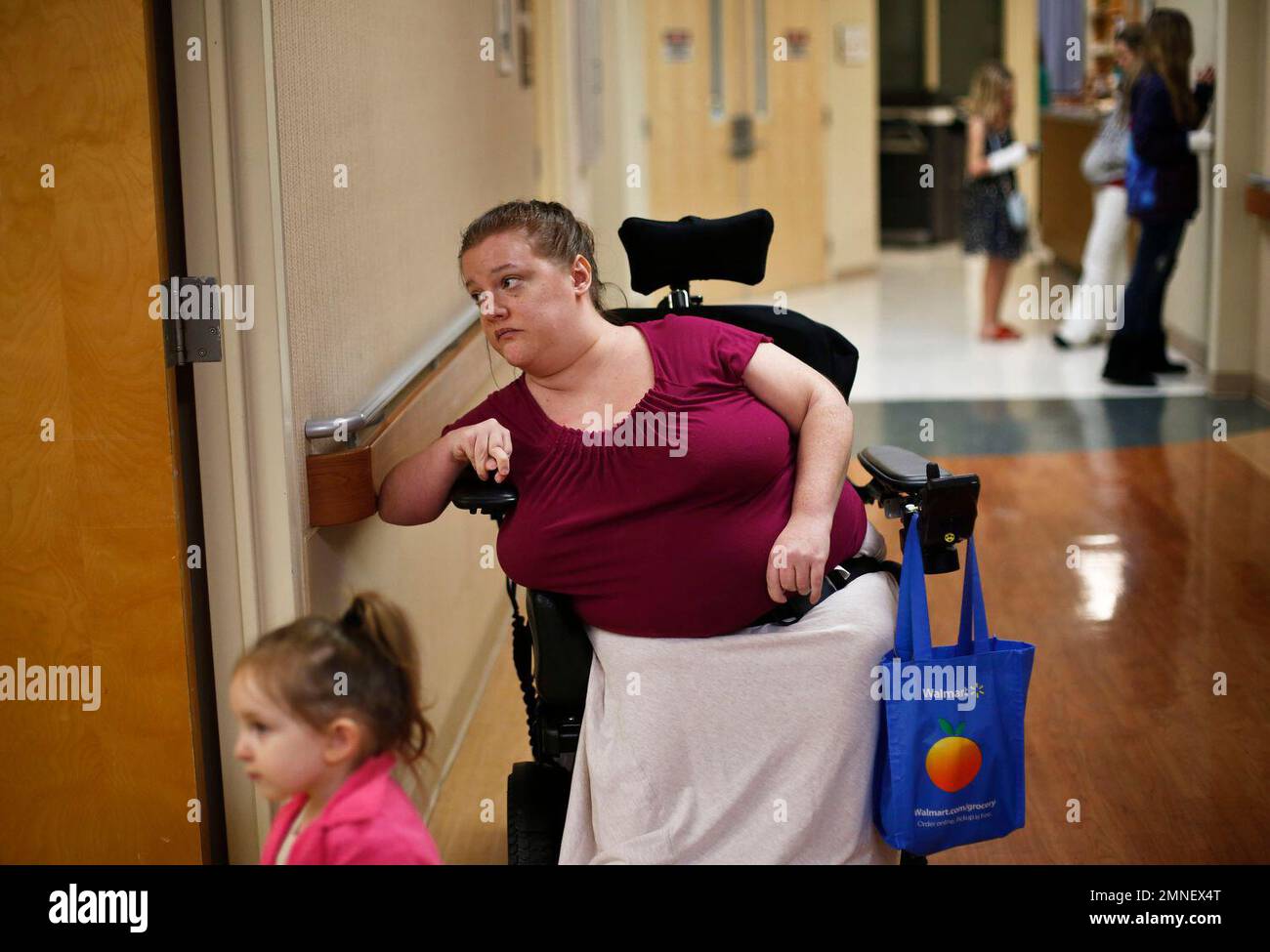 Andrea Chancey, waits in the hallway of a doctors office on Thursday ...