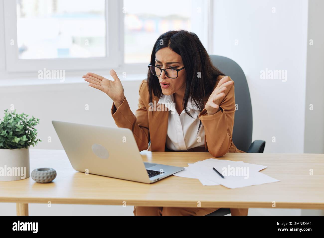 Business woman working in office at desk with laptop, anger and ... Business woman working in office at desk with laptop, anger and ...