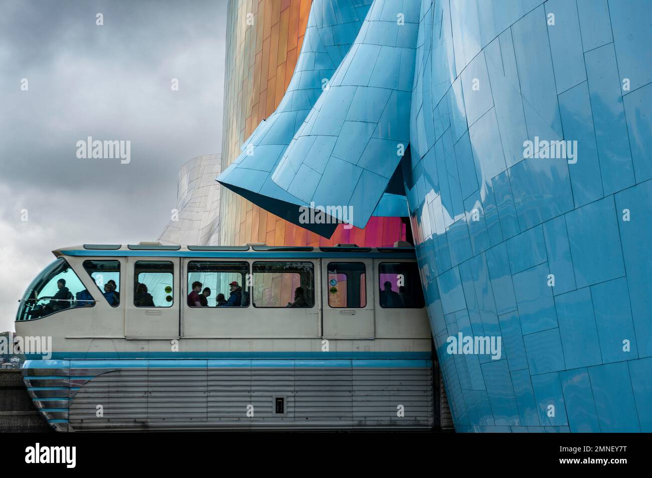 Monorail train runs through museum, colourful corrugated exterior ...