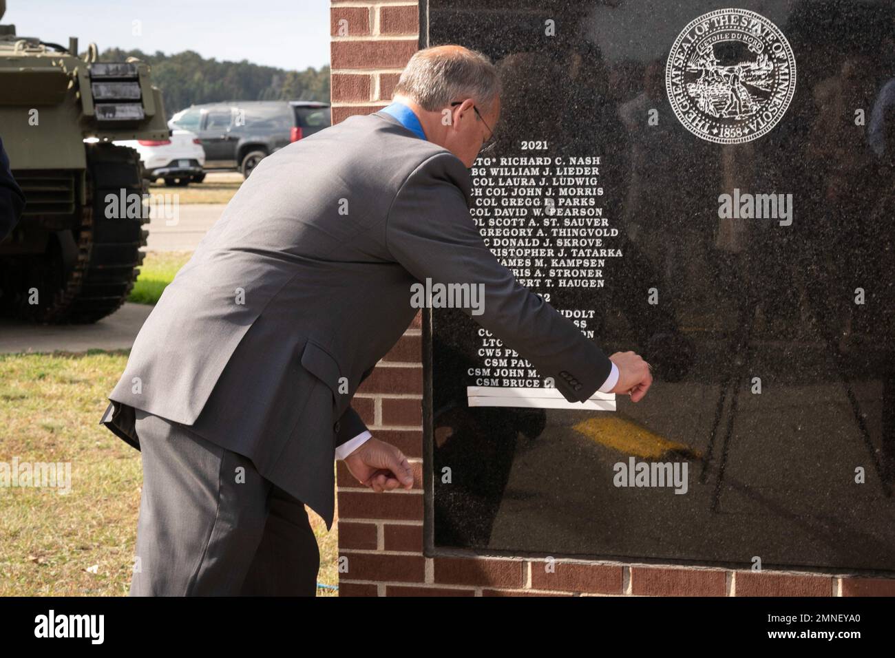 Command Sgt. Maj. (Ret.) Bruce L. Stowe removes the cover from his name ...
