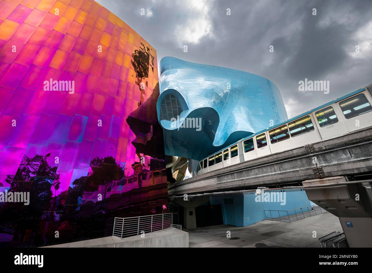 Monorail train runs through museum, colourful corrugated exterior ...