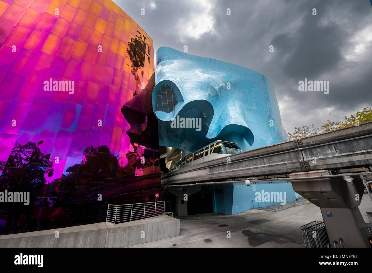 Monorail train runs through museum, colourful corrugated exterior ...