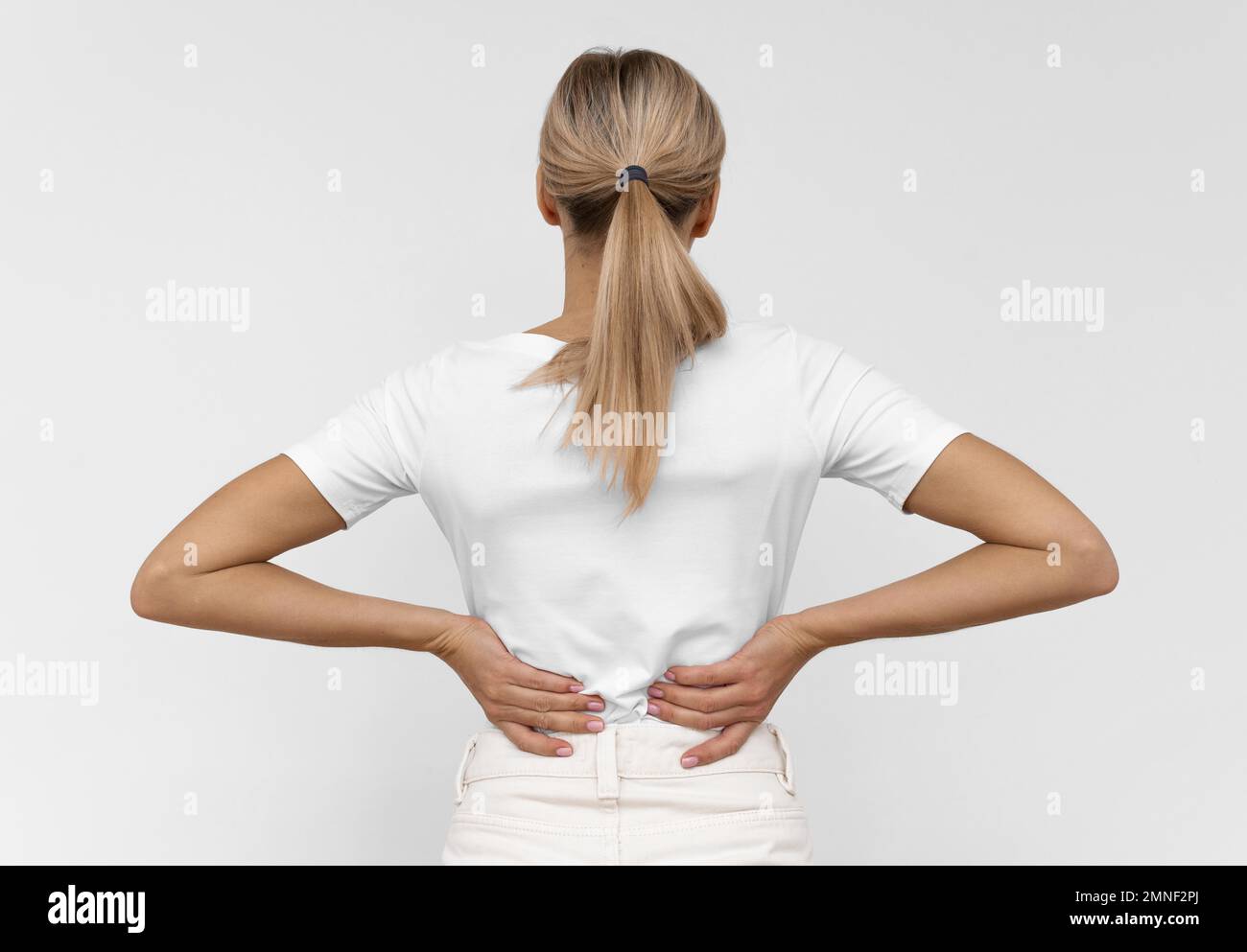 Woman back pain caucasian hi-res stock photography and images - Alamy
