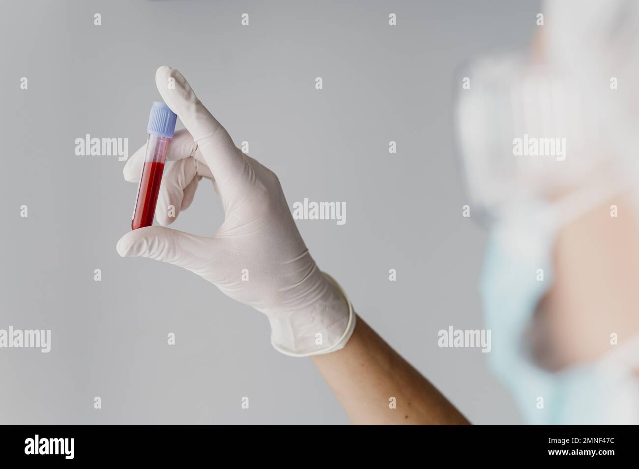 back view doctor holding blood sample. Resolution and high quality ...