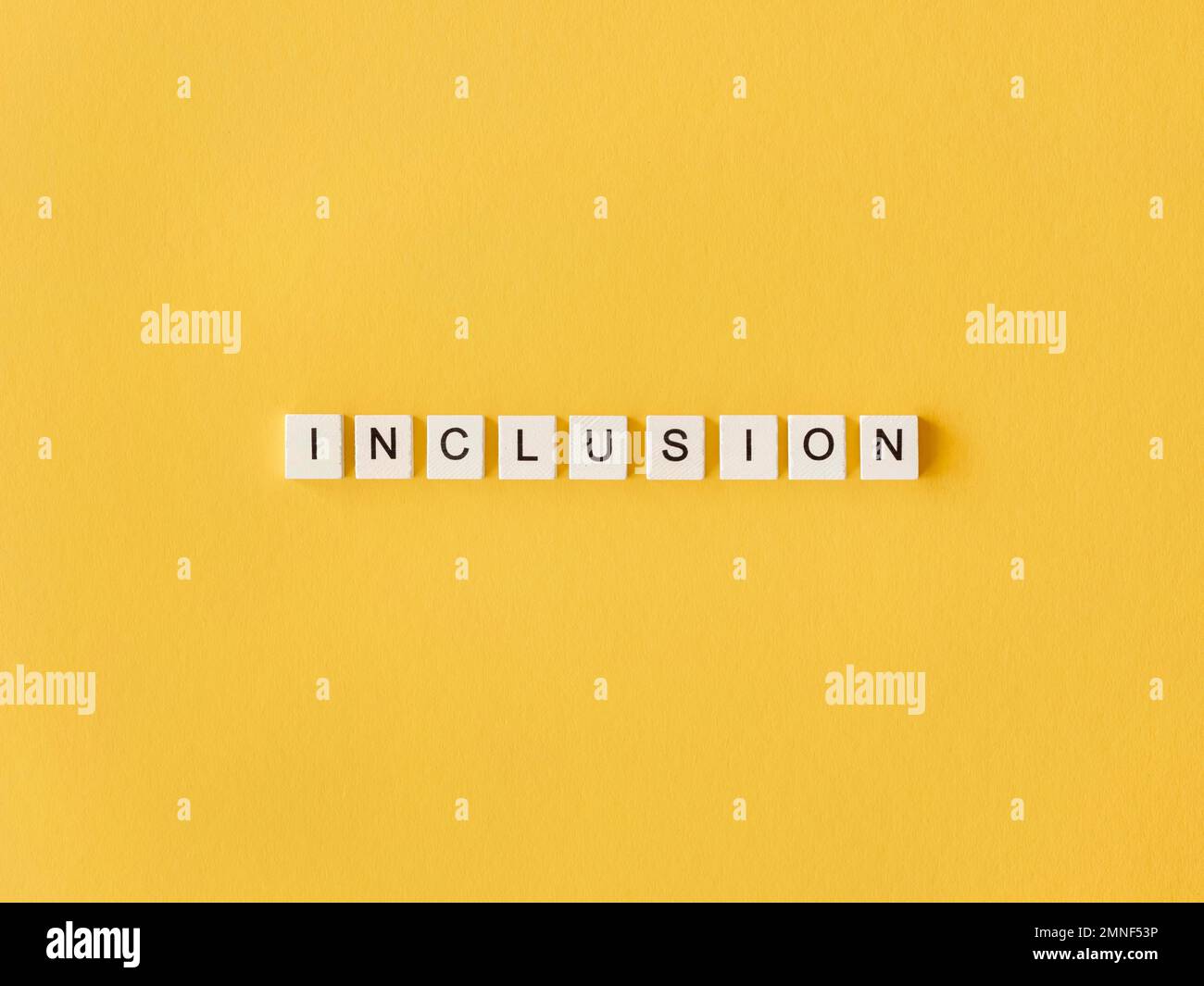 inclusion word written scrabble letters yellow background. High ...