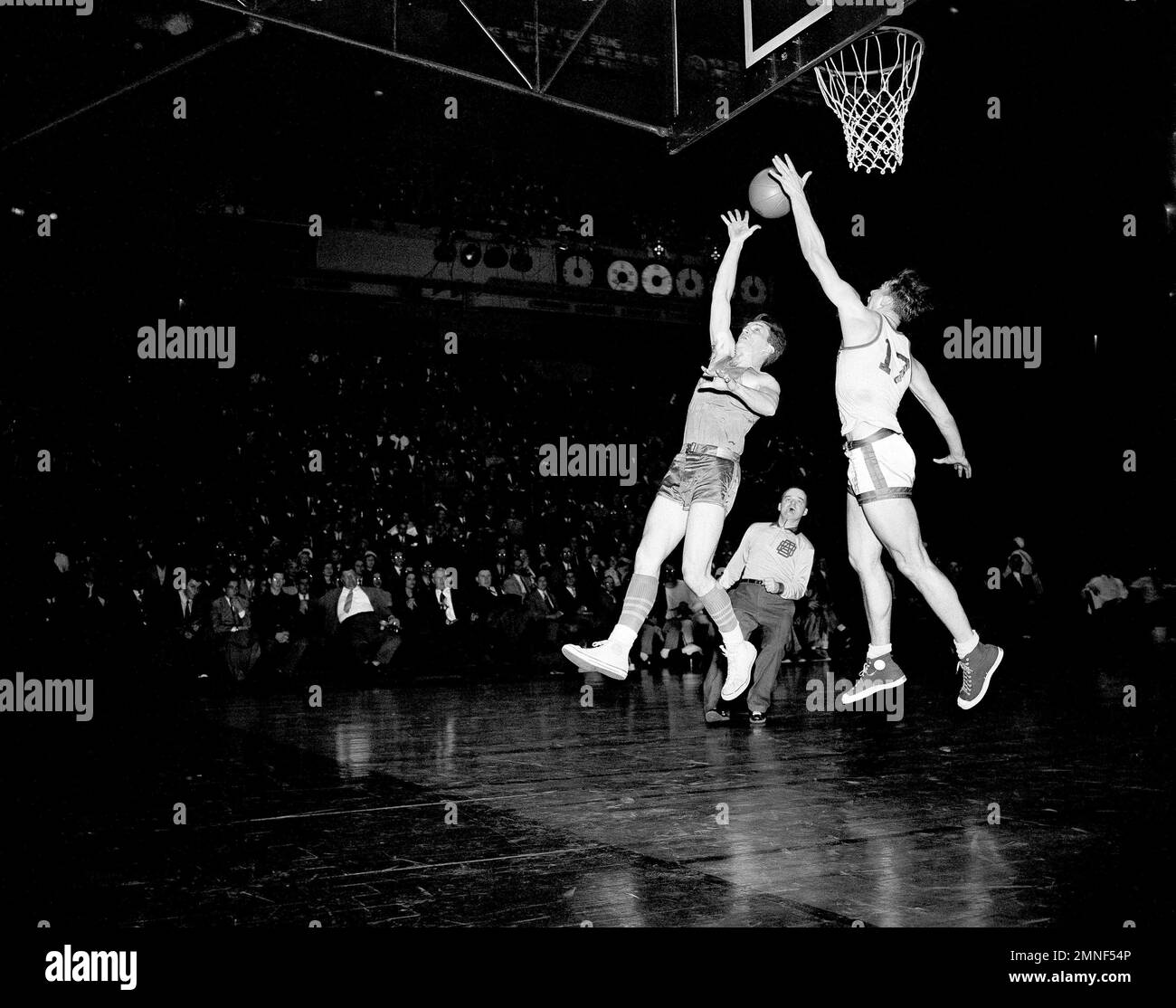 Chick Reiser of the Baltimore Bullets sends the ball past the ...
