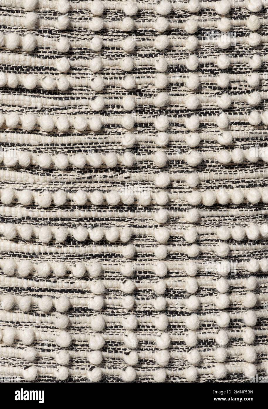 hand woven textile background with bobbles and lines Stock Photo - Alamy