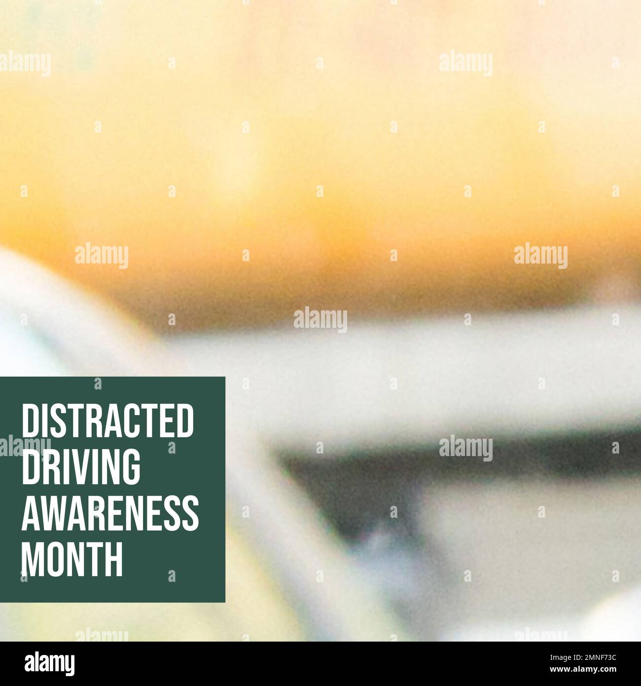 Composition of distracted driving awareness month text on blurred ...