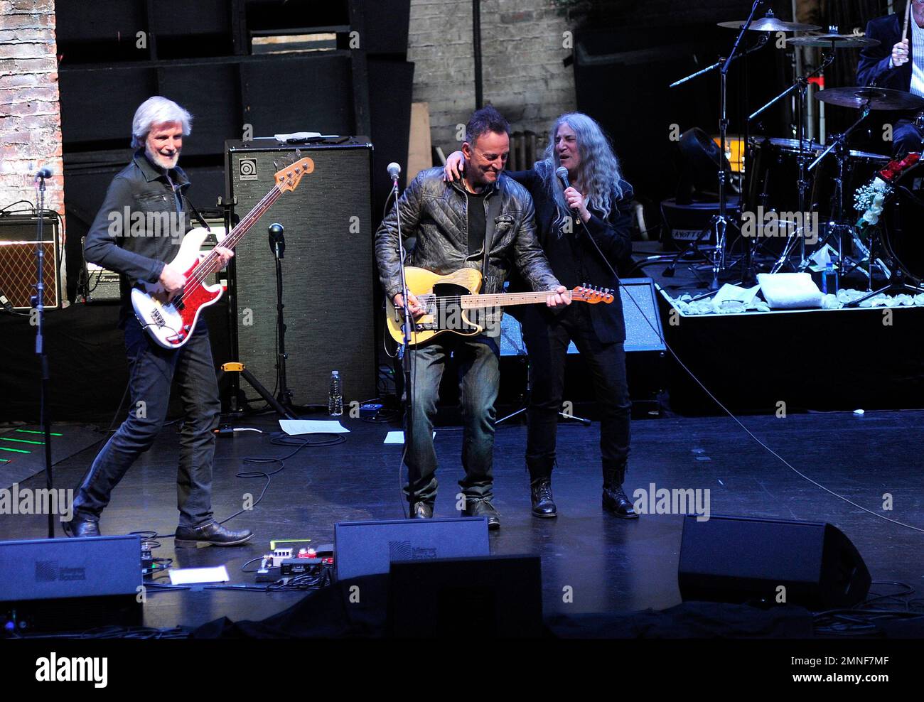 Bruce Springsteen, center, and Patti Smith, right, perform after a ...