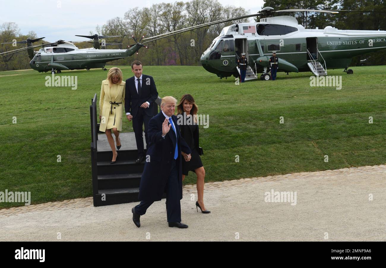 President Donald Trump, second from right, waves as he walks with first ...