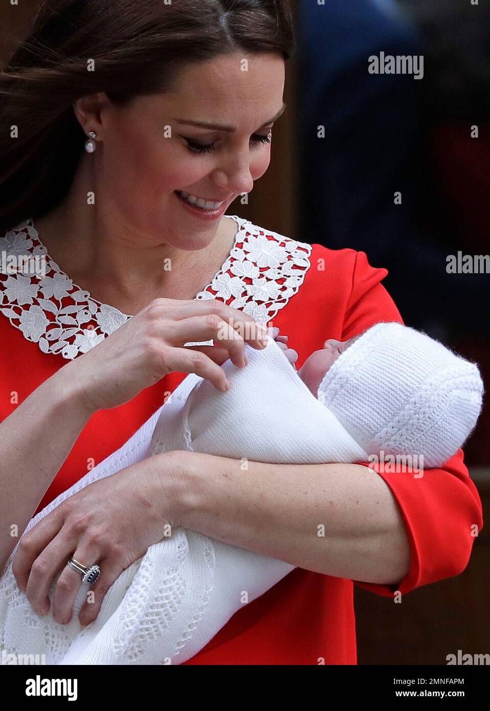 Kate, Duchess of Cambridge holds her newborn baby son as she leaves the ...