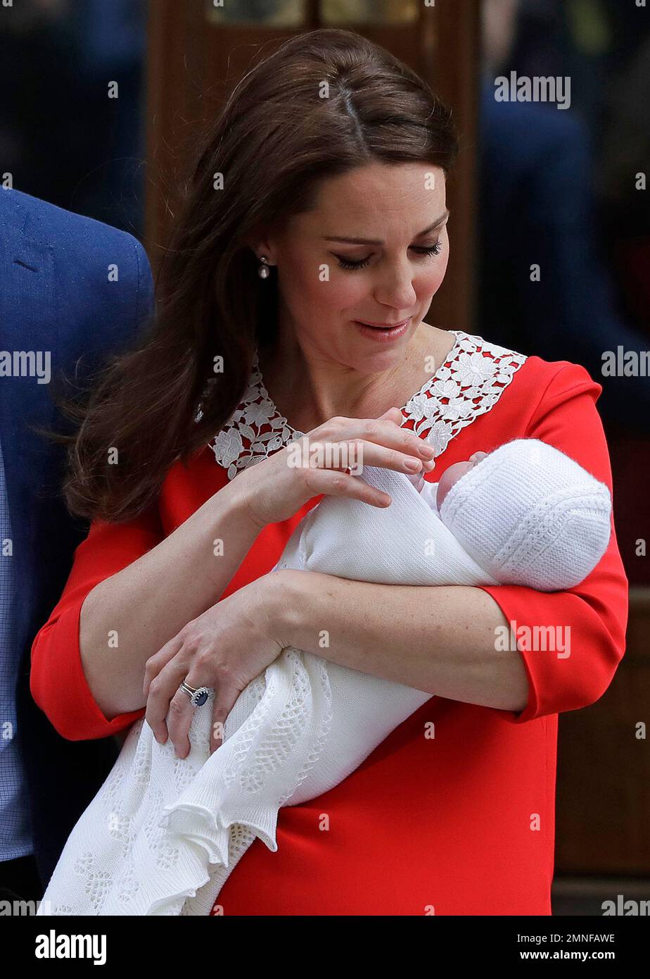 Kate, Duchess of Cambridge holds her newborn baby son as she leaves the ...