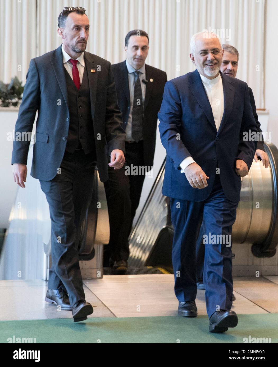 Iranian Foreign Minister Mohammad Javad Zarif, right, arrives for a ...