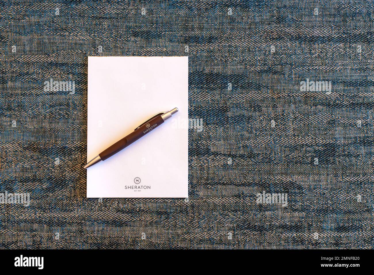 Chandler, AZ - Nov. 20, 2022: Sheraton pen and pad on a textured ...