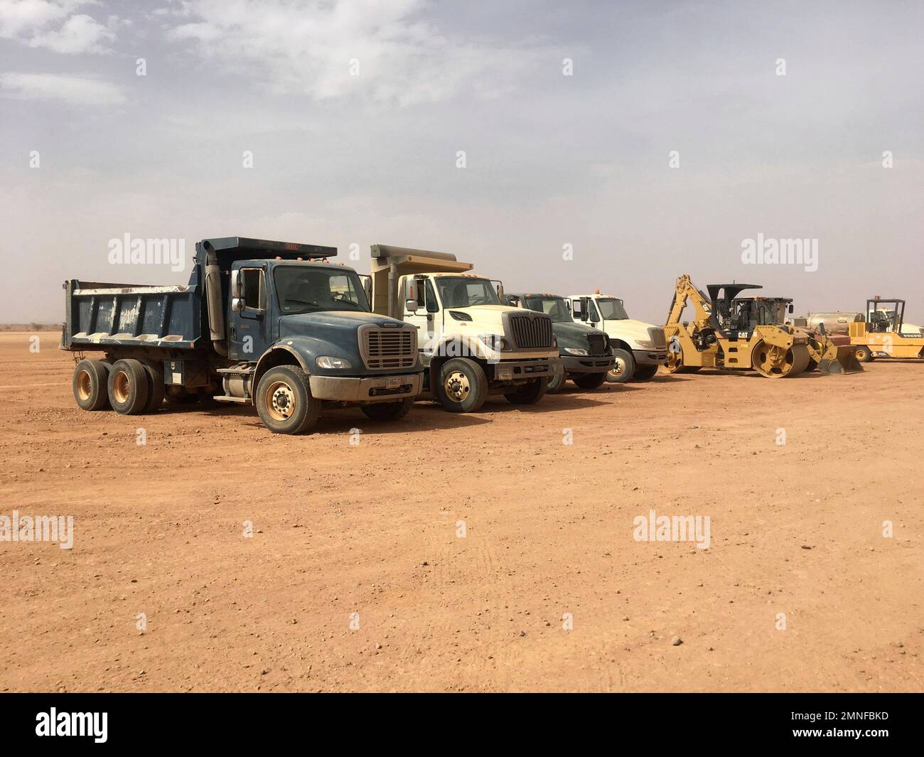 In this photo taken Sunday, April 15, 2018, Trucks and construction ...