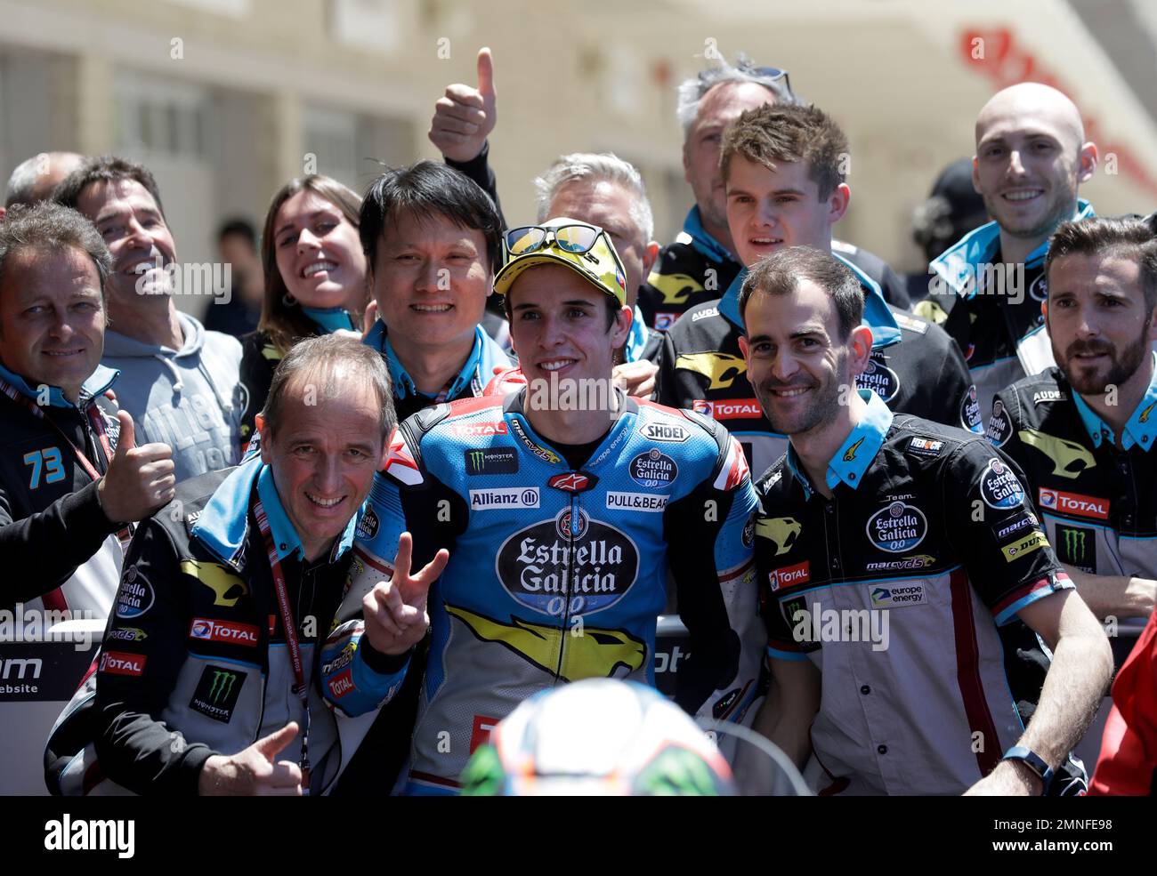 Moto 2 rider Alex Marquez, center, celebrates his second place finish ...
