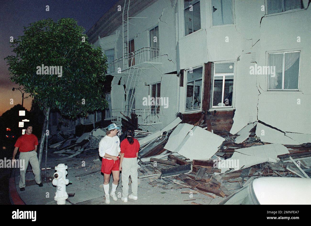 FILE - In this Oct. 17, 1989, file photo, residents look over a ...