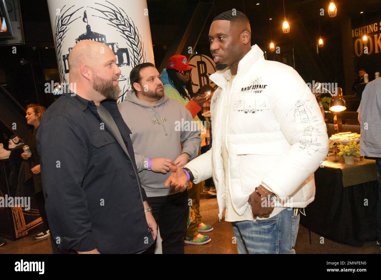 Artist Daniel Gamache (Mache) interacts with guests at the Modelo and ...