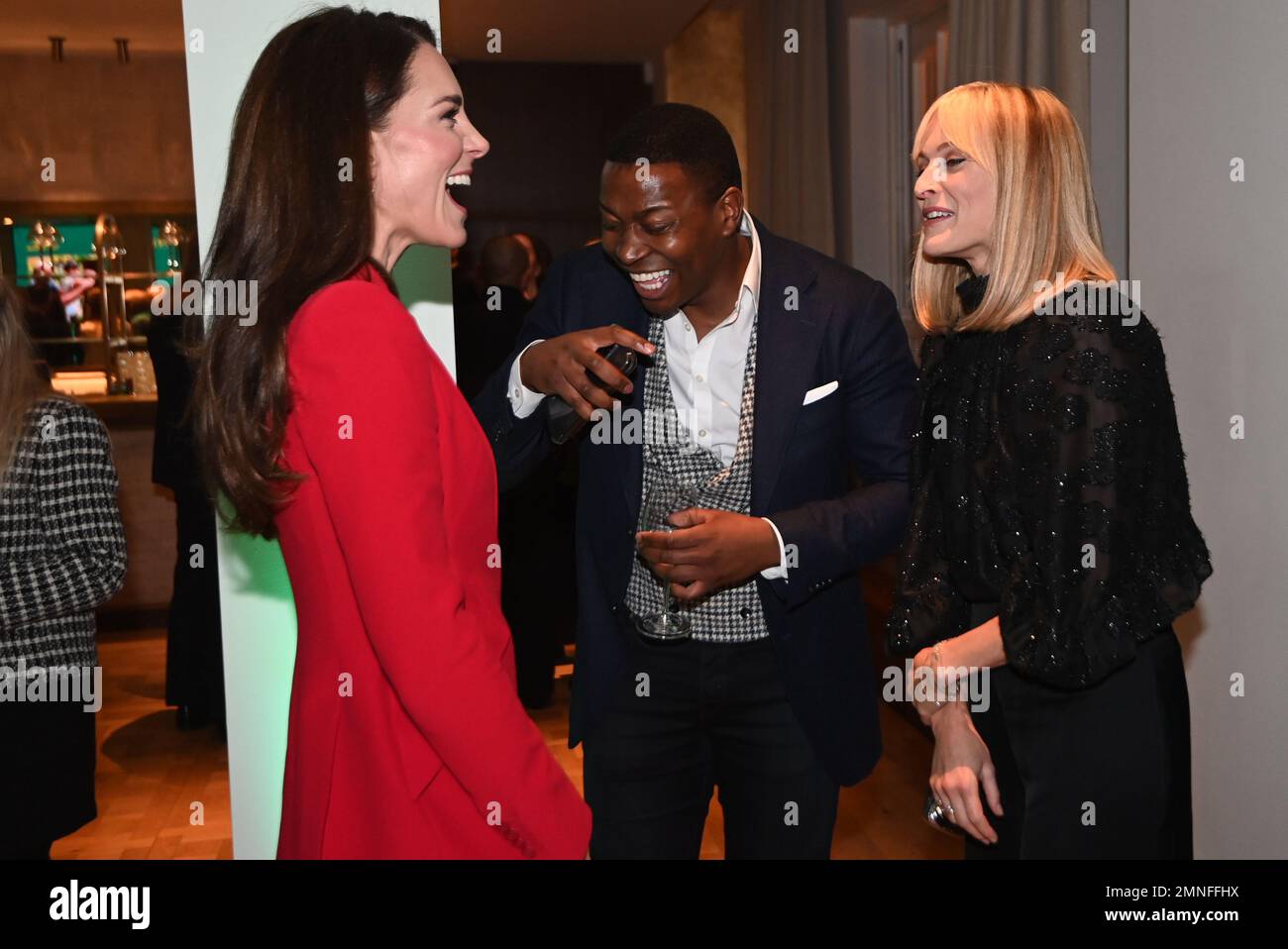 The Princess of Wales (left) laughs with Sol Lovemore (centre) and ...