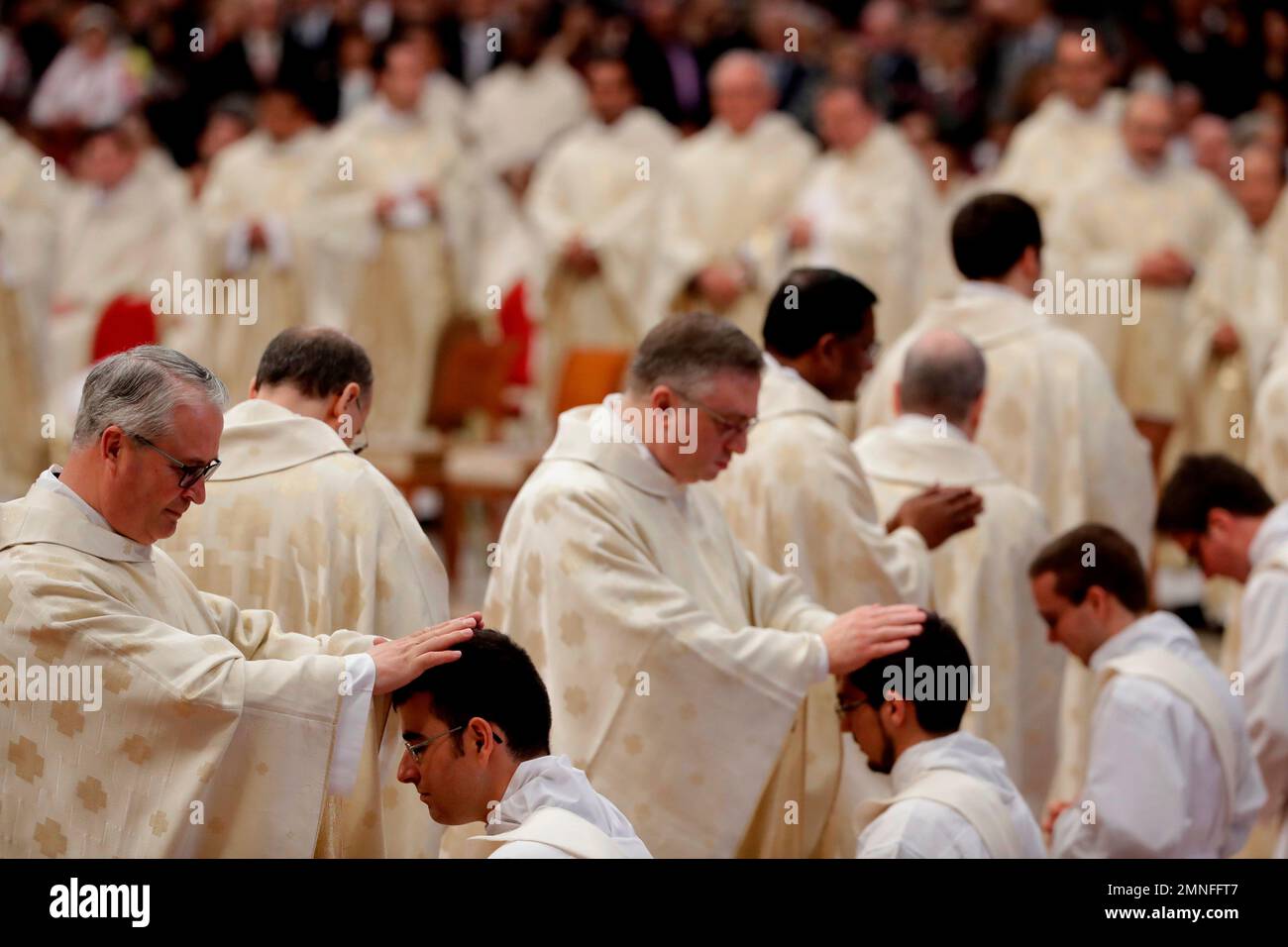 Sixteen new priests are blessed during a ceremony in which Pope Francis ...