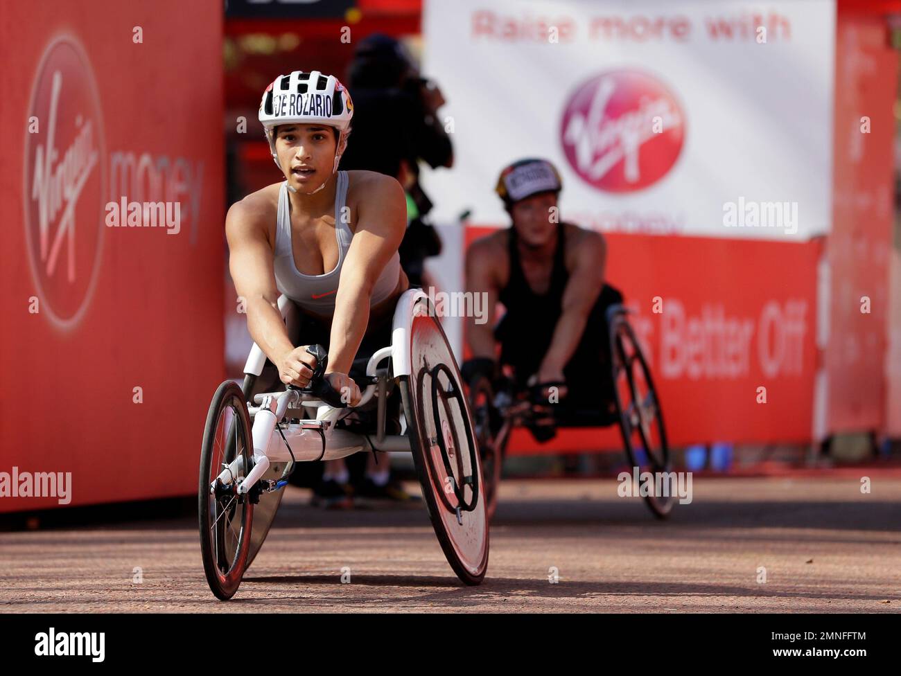 Australia's Madison de Rozario crosses the finish line to win the Women ...