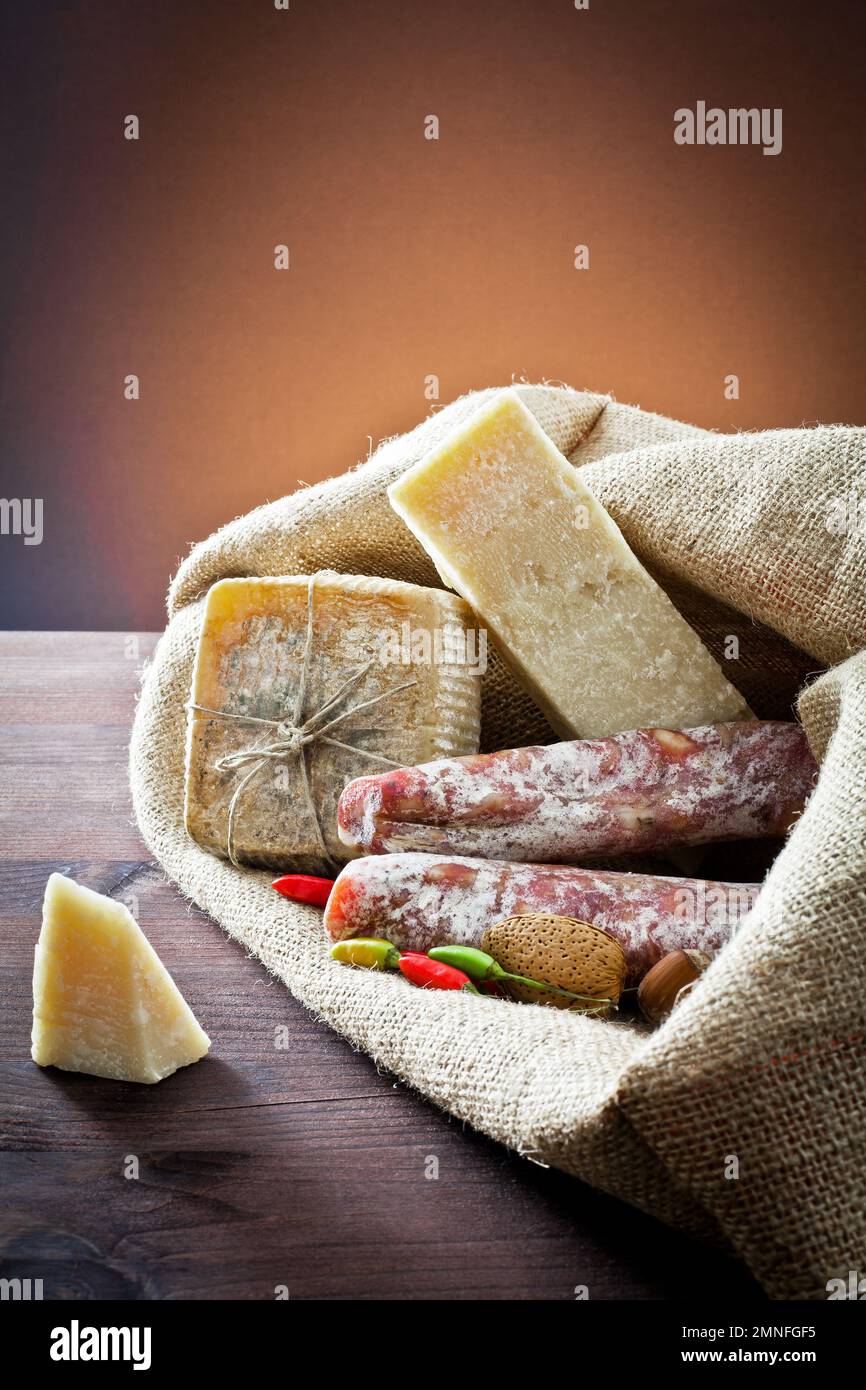 Typical Italian appetizer. Assortment of cheese, salami meats and hot ...