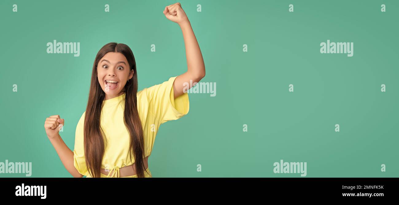 happy successful kid with long hair on blue background, success. Child ...
