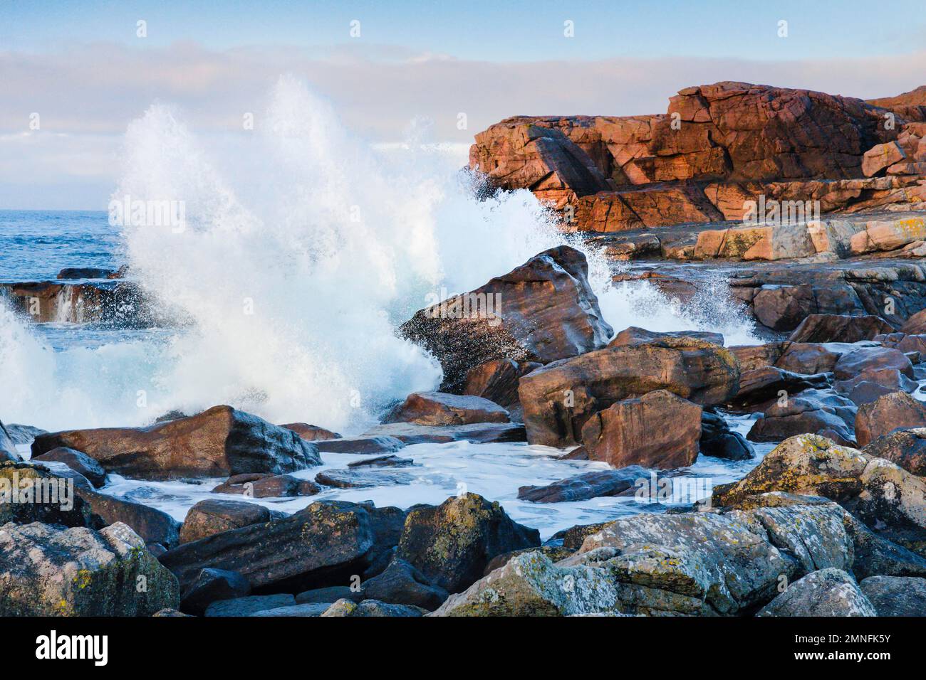 Water dashing against rocks on the rocky coast on Isle of Skye ...