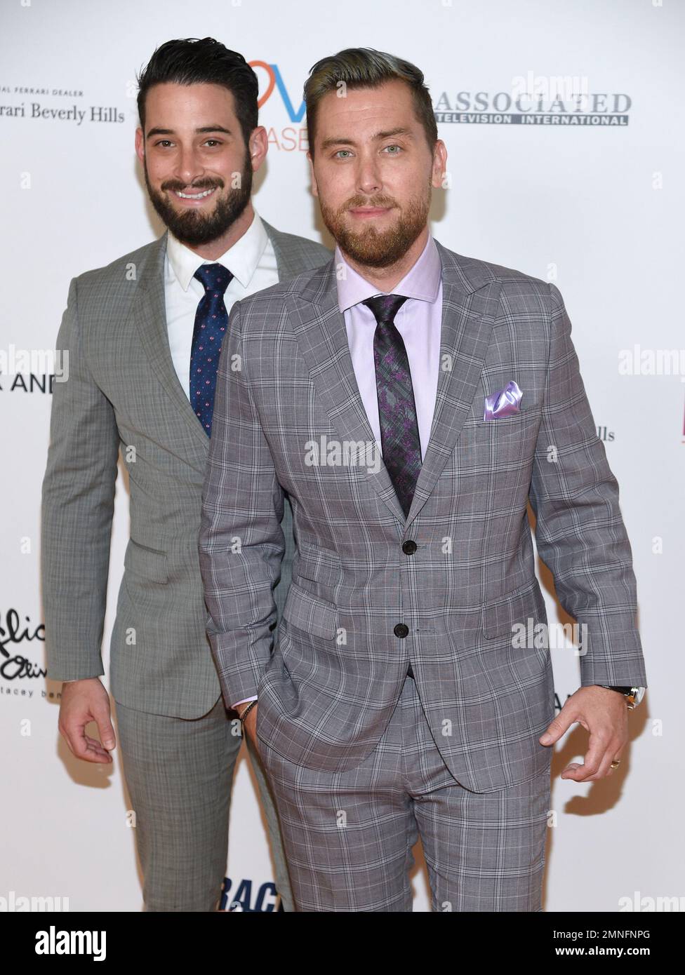 Michael Turchin, left, and Lance Bass arrive at the 25th annual Race to ...