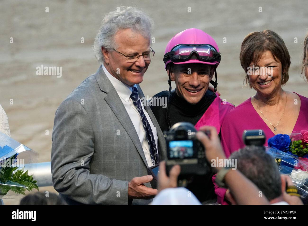 William Mott, trainer of the horse Art Collector, left, poses with ...