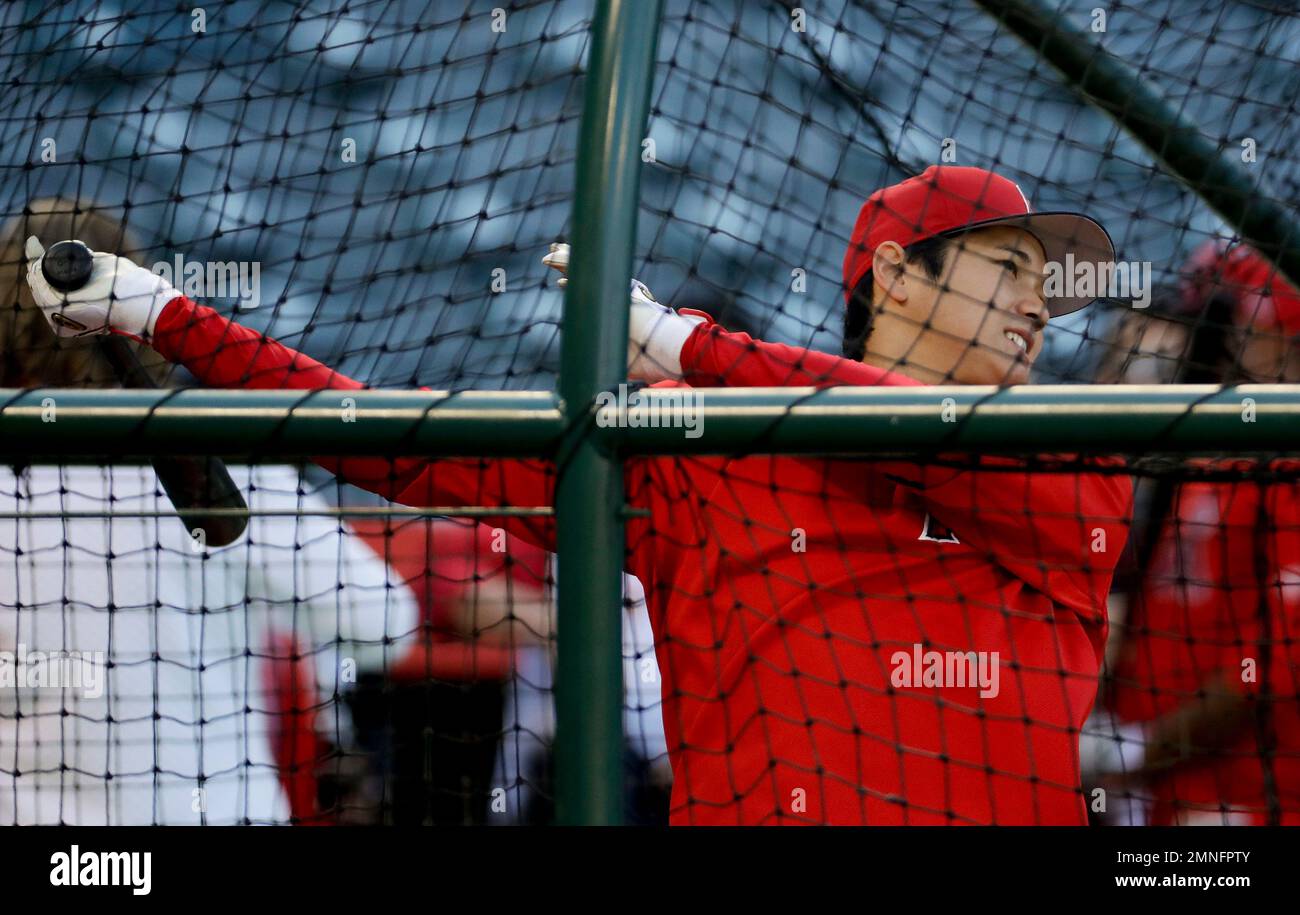 Los Angeles Angels designated hitter Shohei Ohtani, of Japan, takes ...