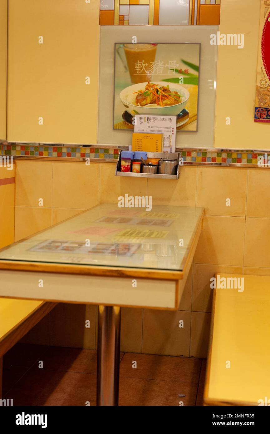 The interior of a traditional Cha chaan teng cafe, with booth seating ...