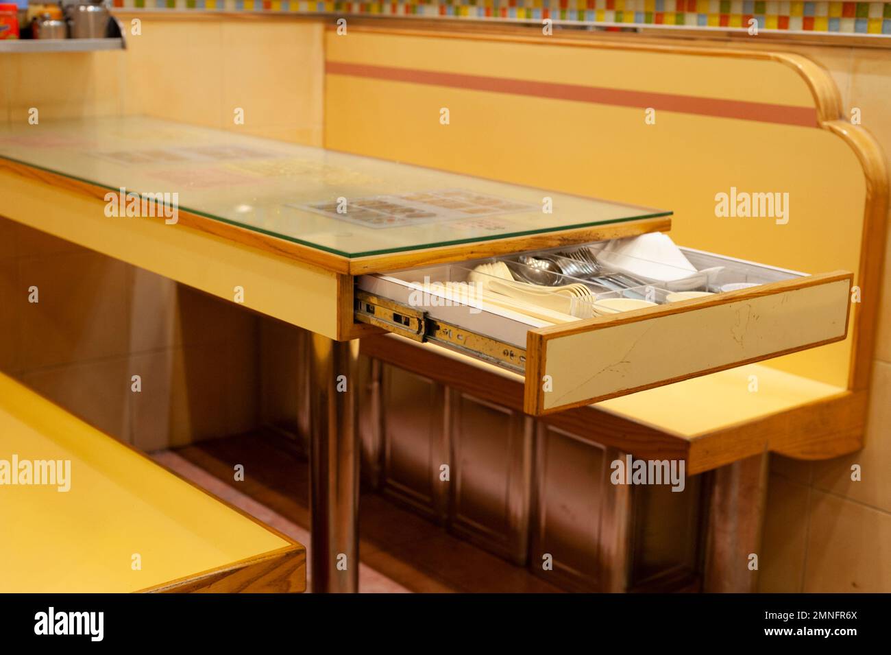 The interior of a traditional Cha chaan teng cafe, with booth seating ...