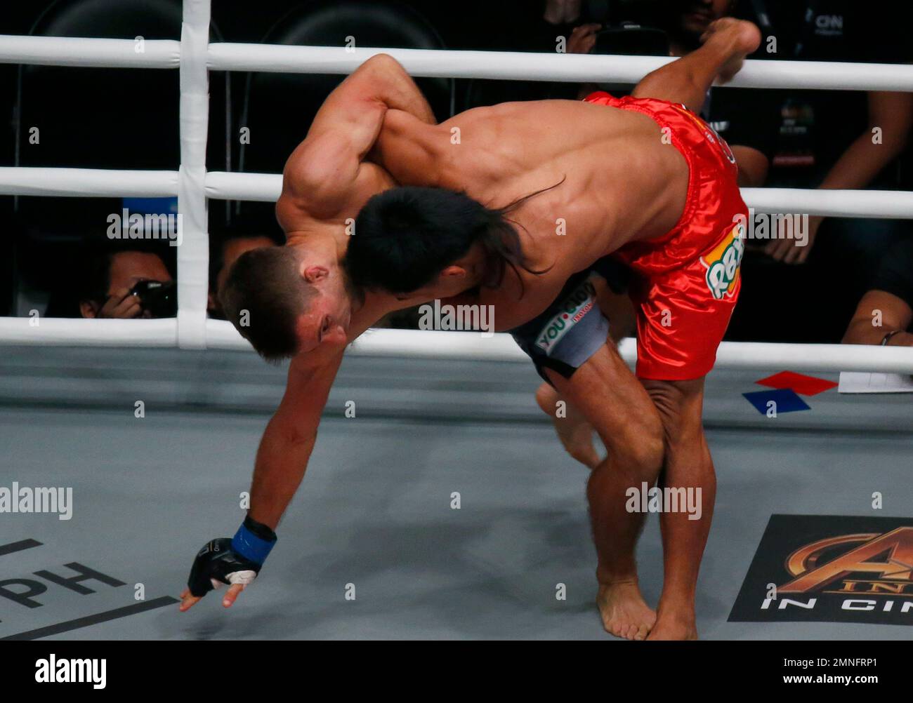 The Philippines' Kevin Belingon, right, takes down American Andrew ...