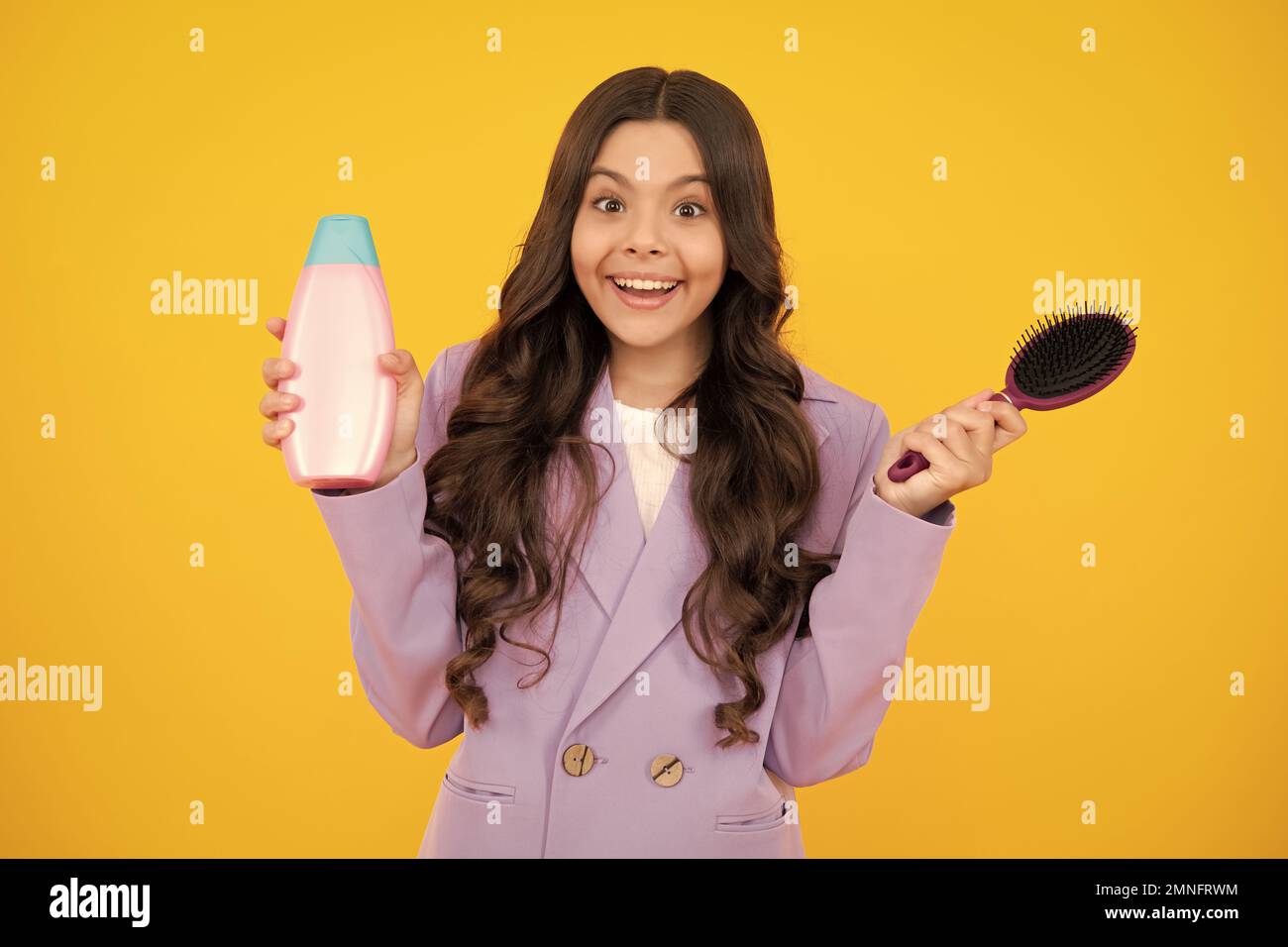 Teenage girl with shampoos conditioners or shower gel. Kids hair care ...