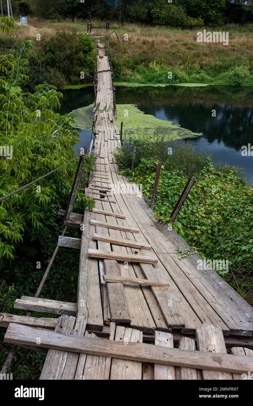 Vertical view of the footbridge over the river, skewed and lying on the ...
