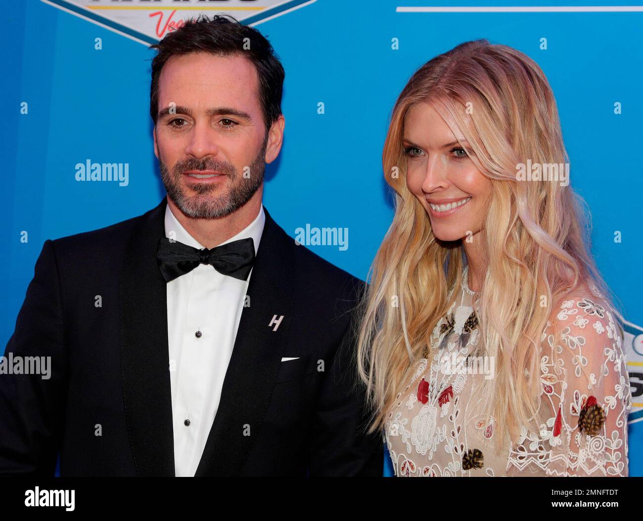 FILE - In this Dec. 2, 2016, file photo, Jimmie Johnson and wife ...
