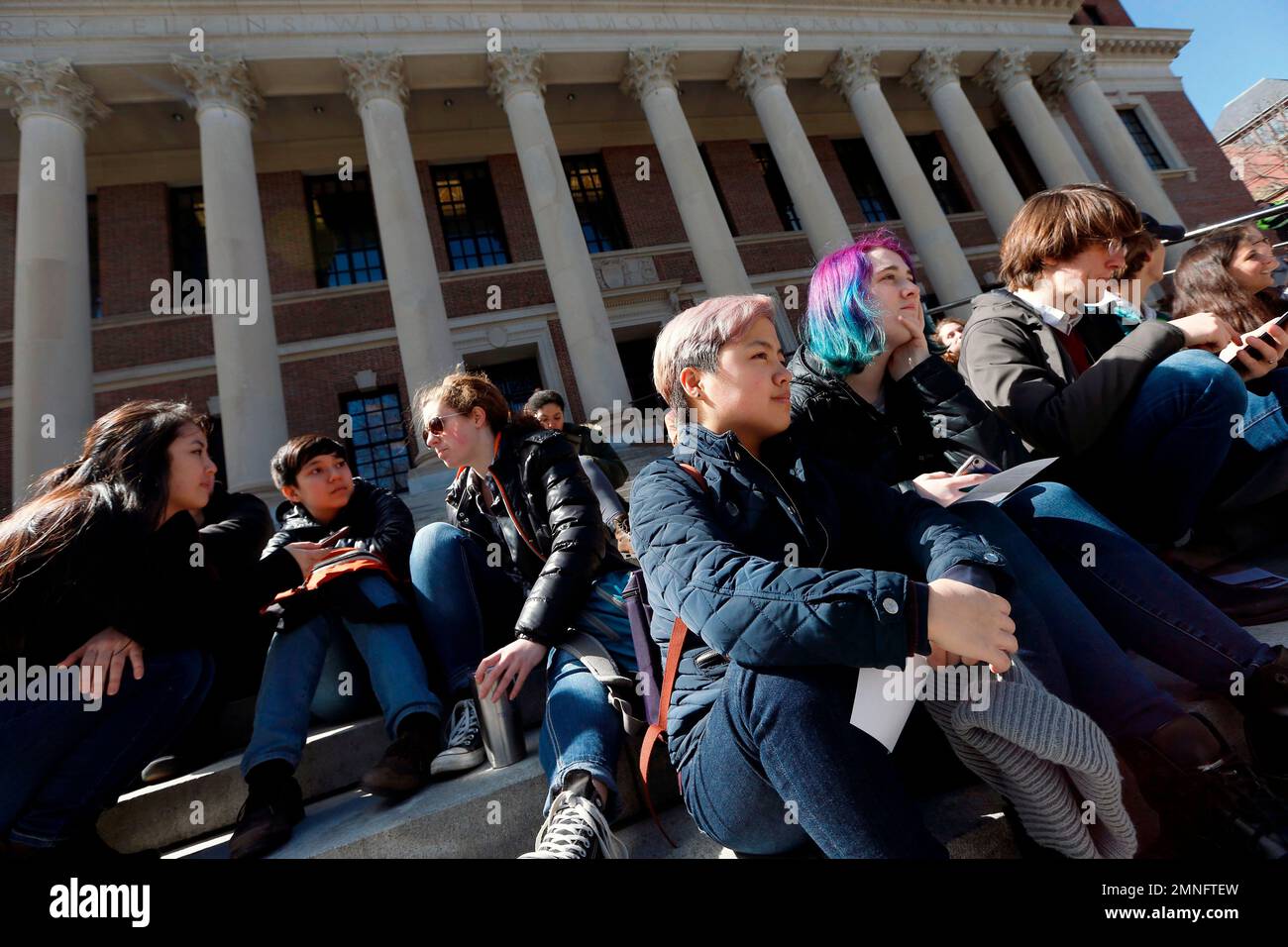 Harvard University students Angela Kim, center, and Brooke Martin ...