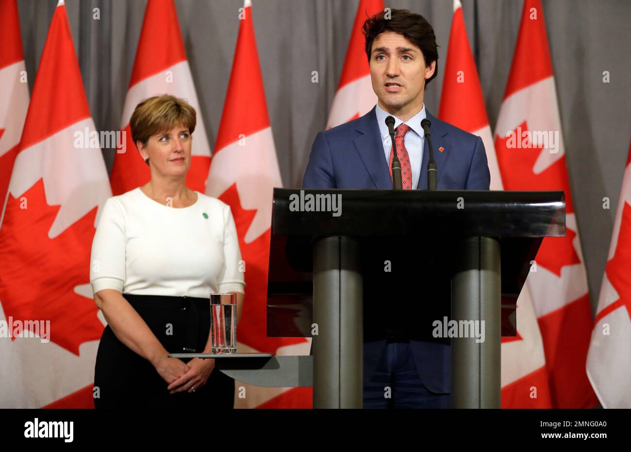 Canada's Prime Minister Justin Trudeau speaks as Canada's Minister of ...