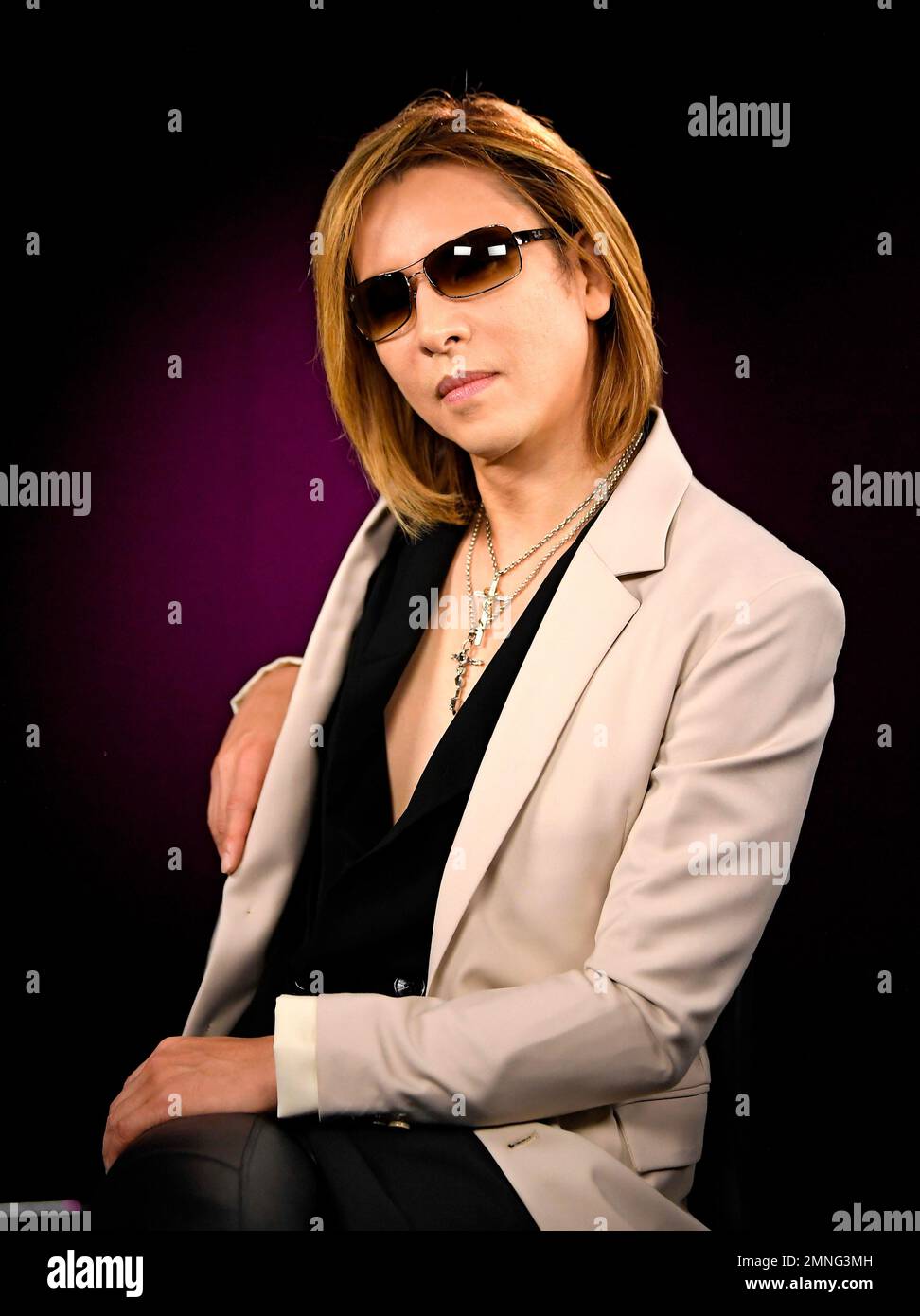 Japanese rock star Yoshiki poses in during an interview with the ...