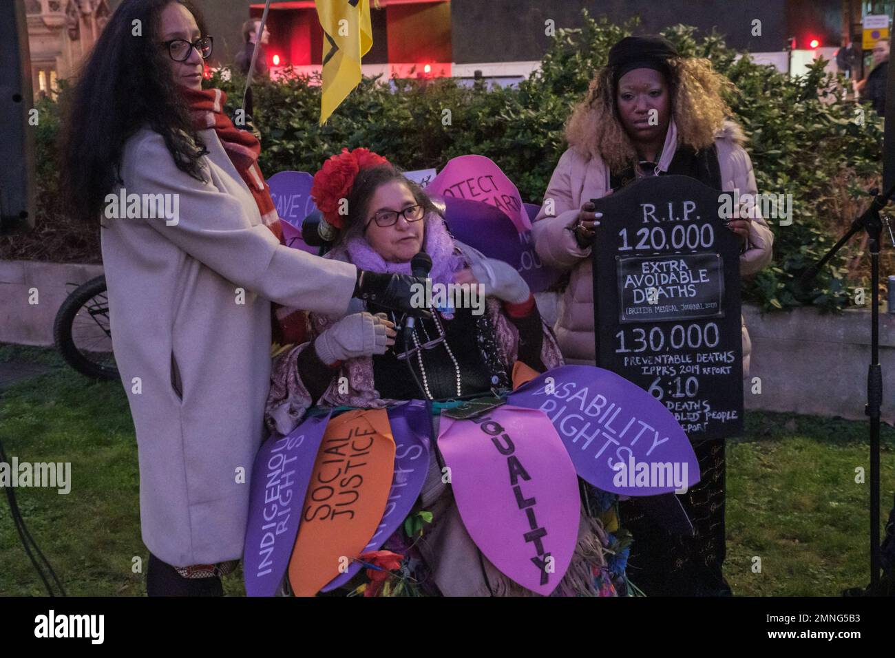 London, UK. 30 Jan 2023. Mary Ellen from DPAC speaks. People protest ...