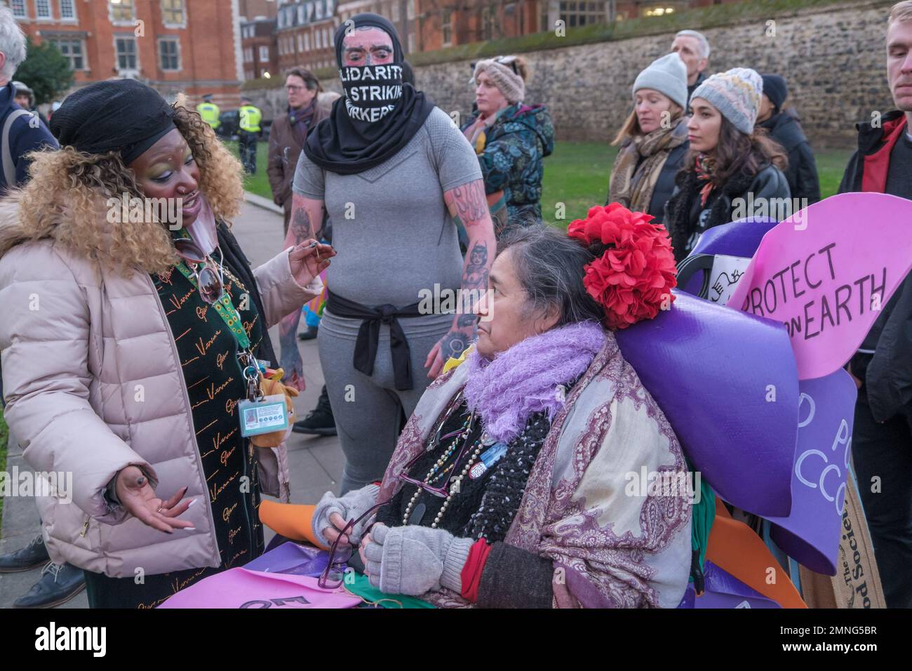 London, UK. 30 Jan 2023. Mazzy talks with Mary Ellen. People protest ...