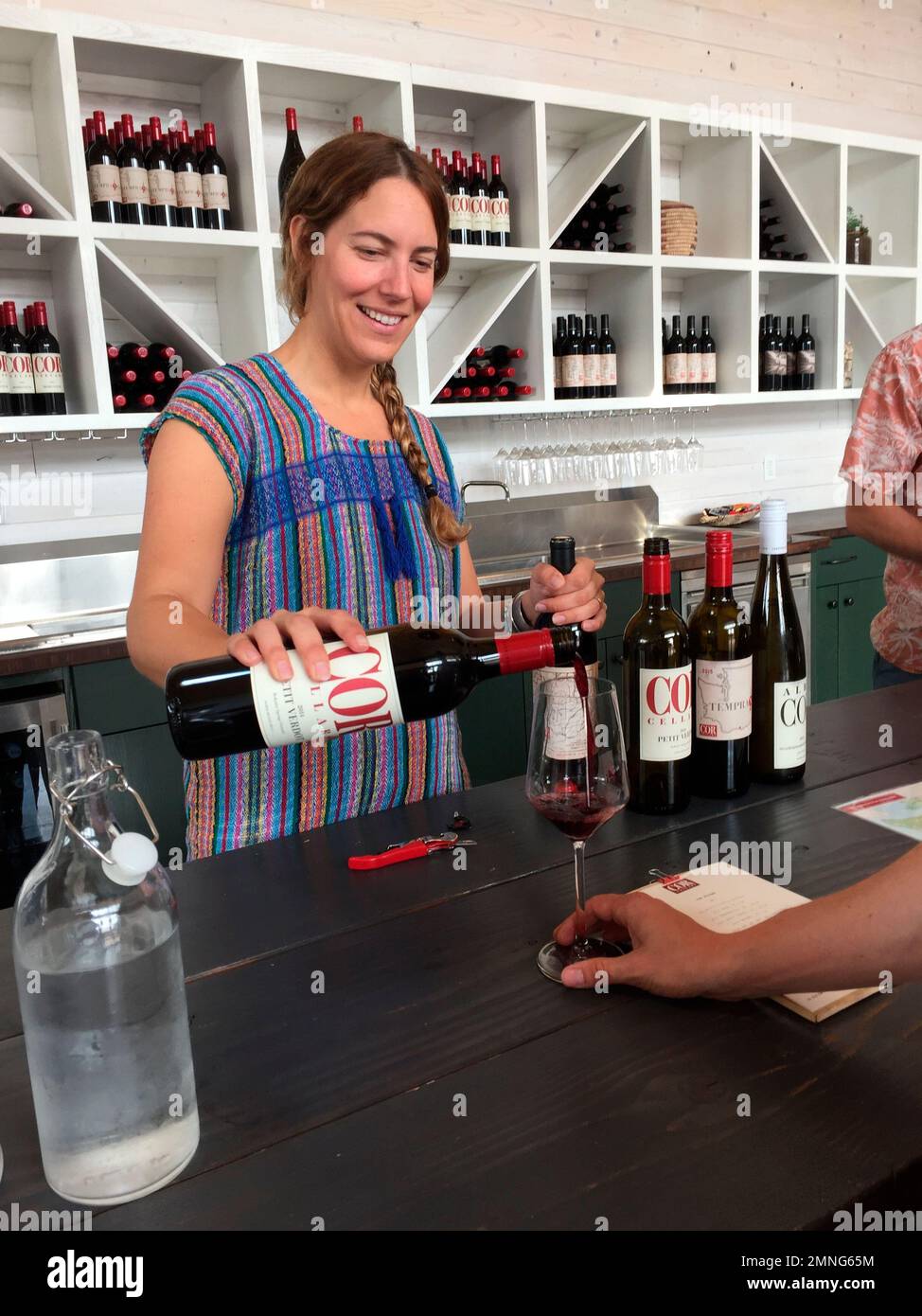 This Aug. 11, 2017 photo shows a server pouring a wine tasting at COR ...
