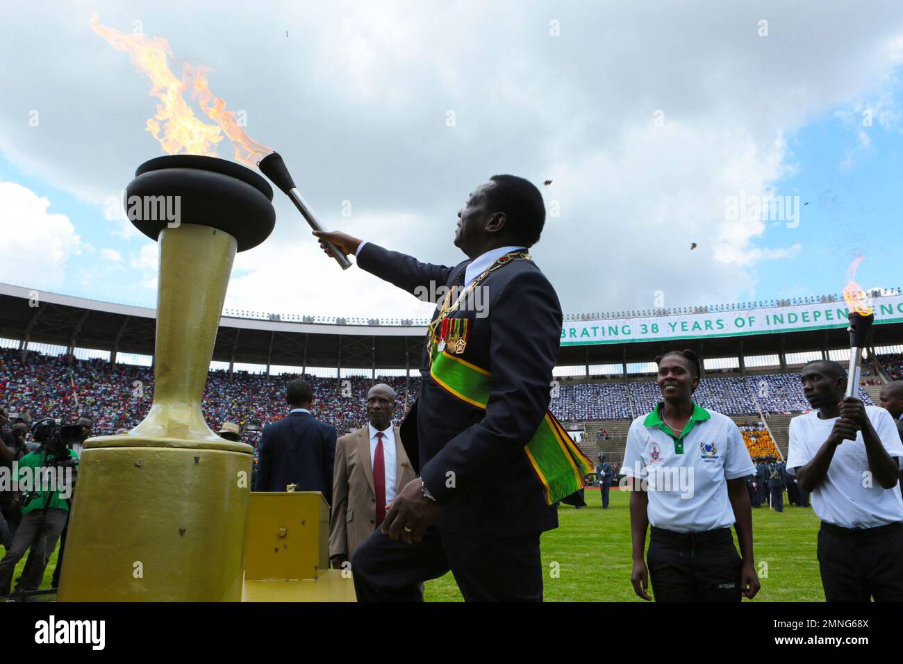 Zimbabwe's President Emmerson Mnangagwa lights the independence torch ...
