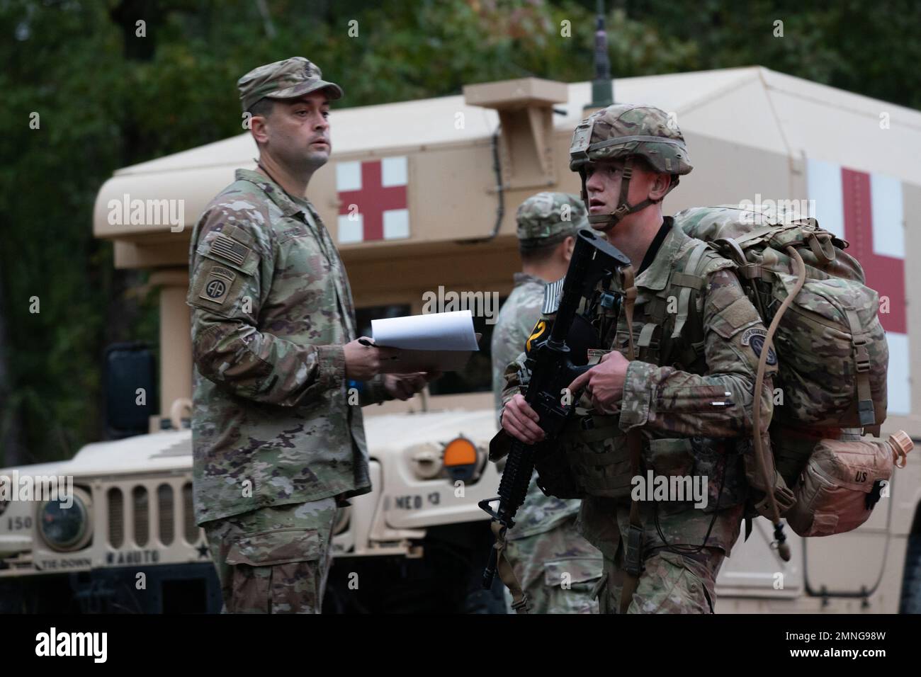 U.S. Army Sgt. Drake Turner passes cadre as he completes the 12-mile ...
