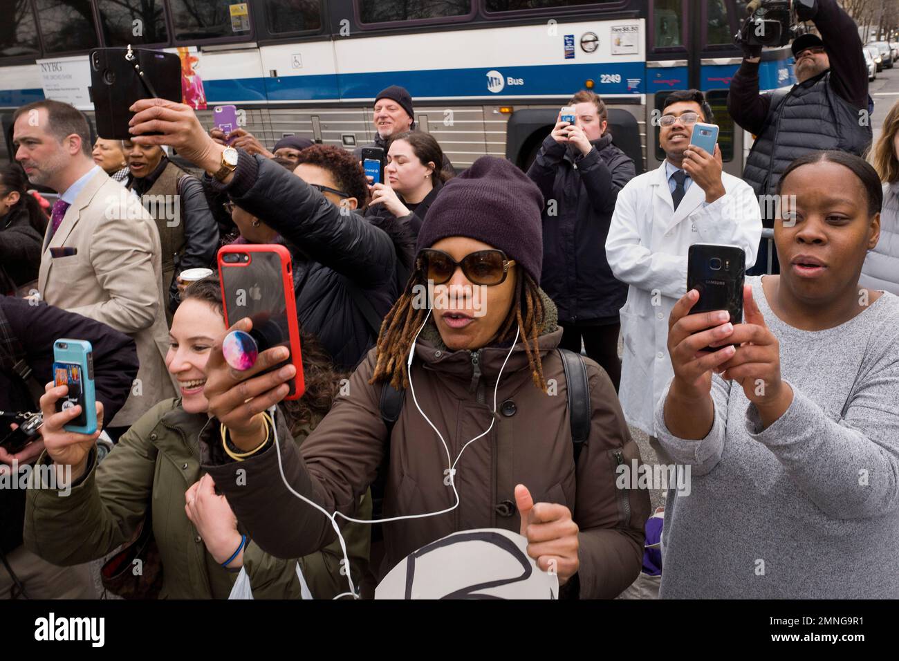A small crowd gathers to watch as the statue of Dr. J. Marion Sims, is ...