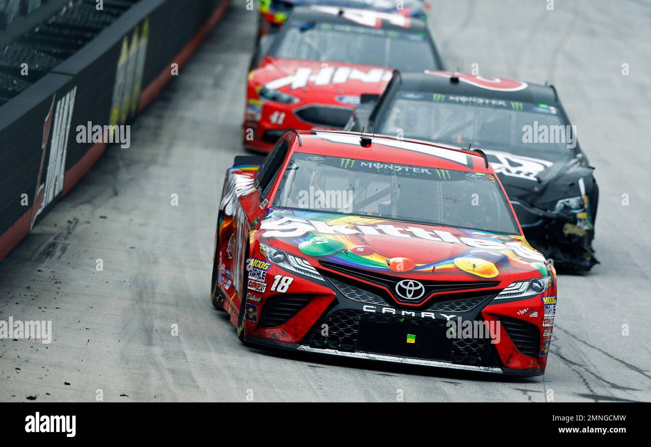 Kyle Busch leads Trevor Bayne and Kurt Busch (41) during a NASCAR Cup ...